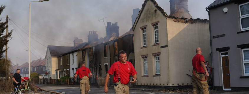Fire engulfs homes as UK temperatures soar