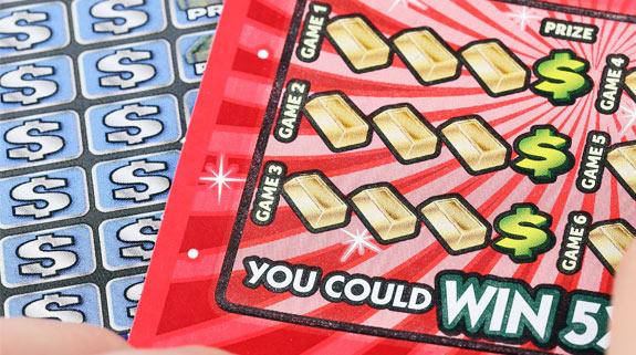 Gold Coast woman almost throws out life-changing scratchie ticket