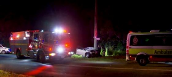 Two injured after car wraps around power pole in horror Gold Coast crash