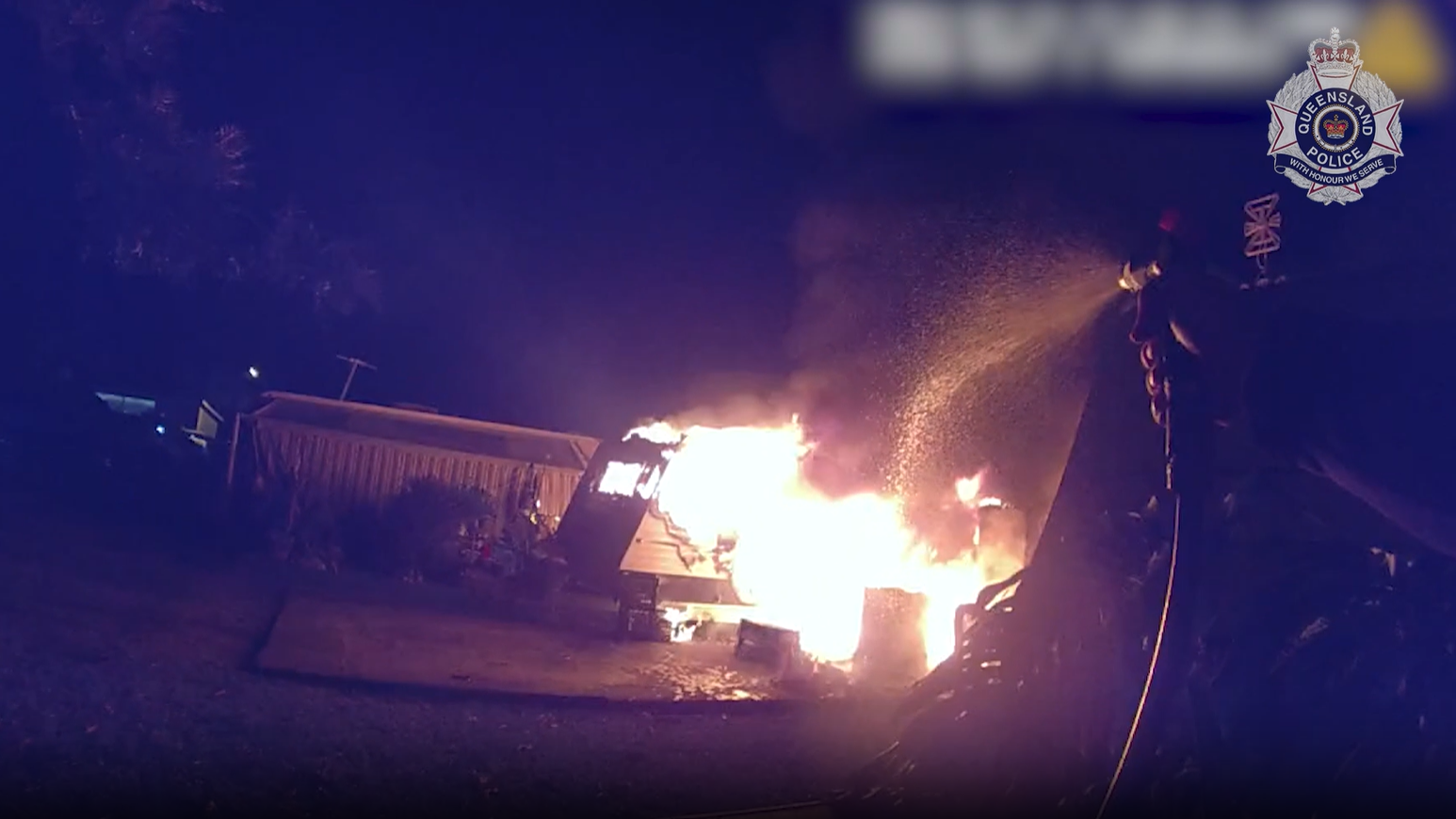 WATCH: Quick-thinking cop stops Gold Coast caravan fire from spreading
