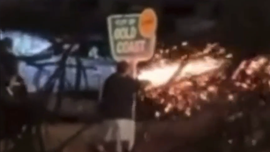 WATCH: Hunt on for "grubs" who stole famous Gold Coast sign